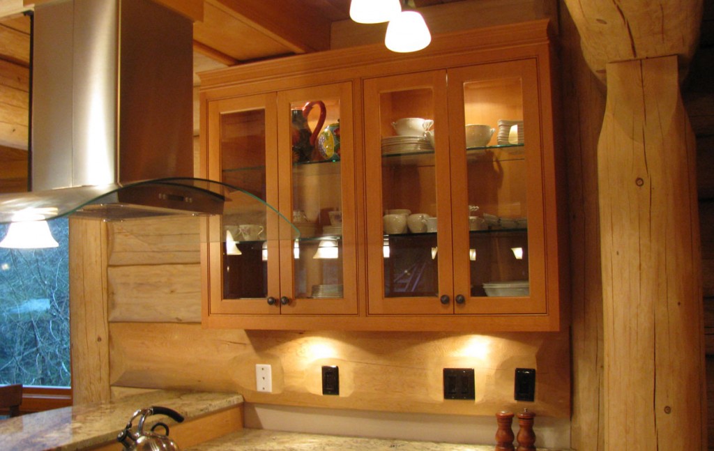 Log home kitchen features vertical grain douglas fir cabinets